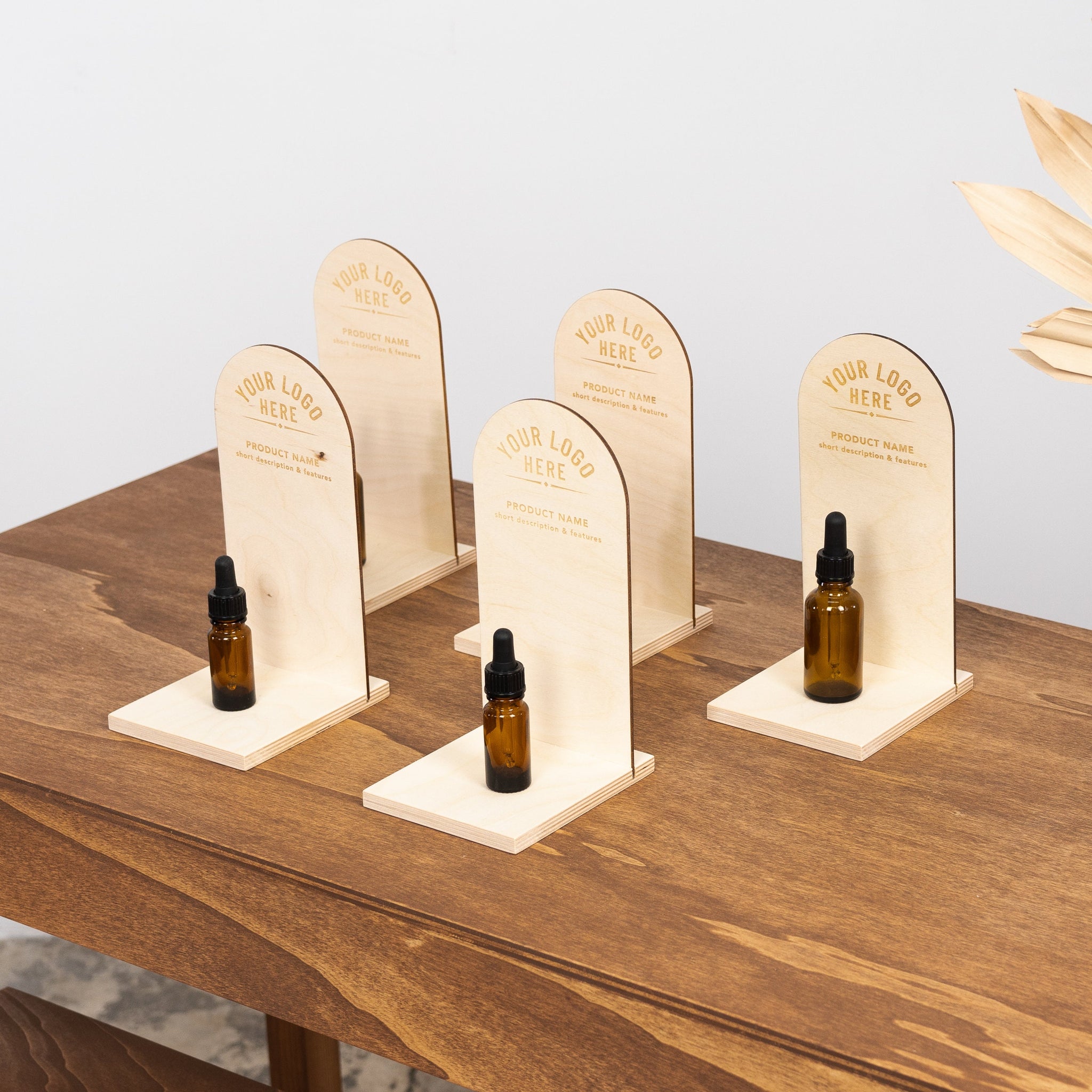 Set of individual rounded plywood POS product displays personalized wi ...